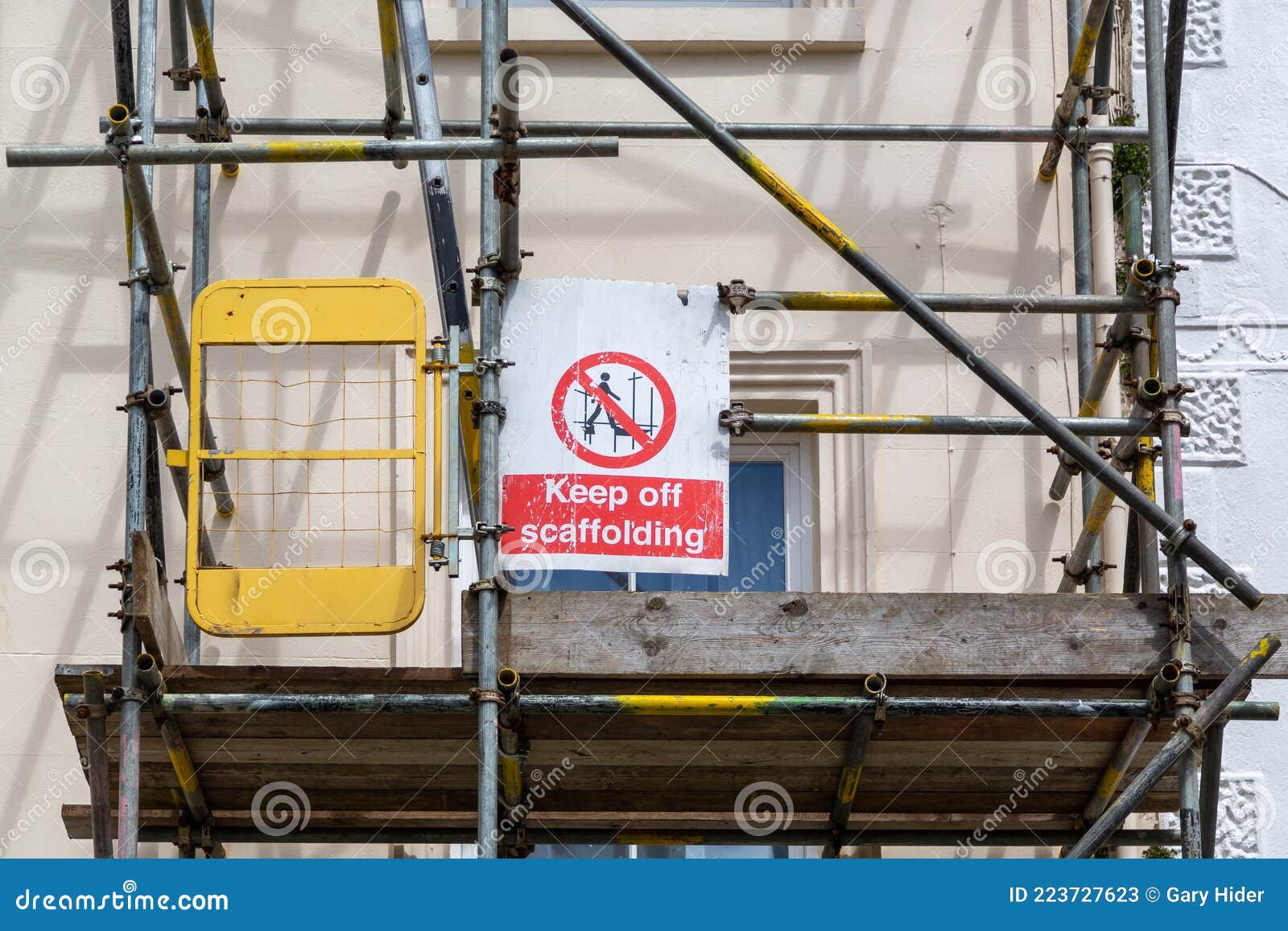 Scaffolding on the Side of a Building with a Sign that Reads Keep Off Scaffolding Stock Image ...