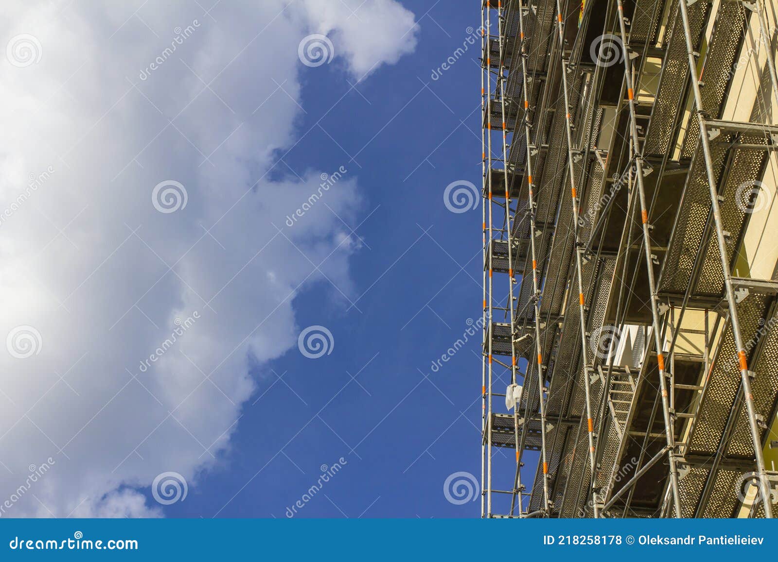 Scaffolding on a Skyscraper Against the Background of a Blue Summer Sky ...