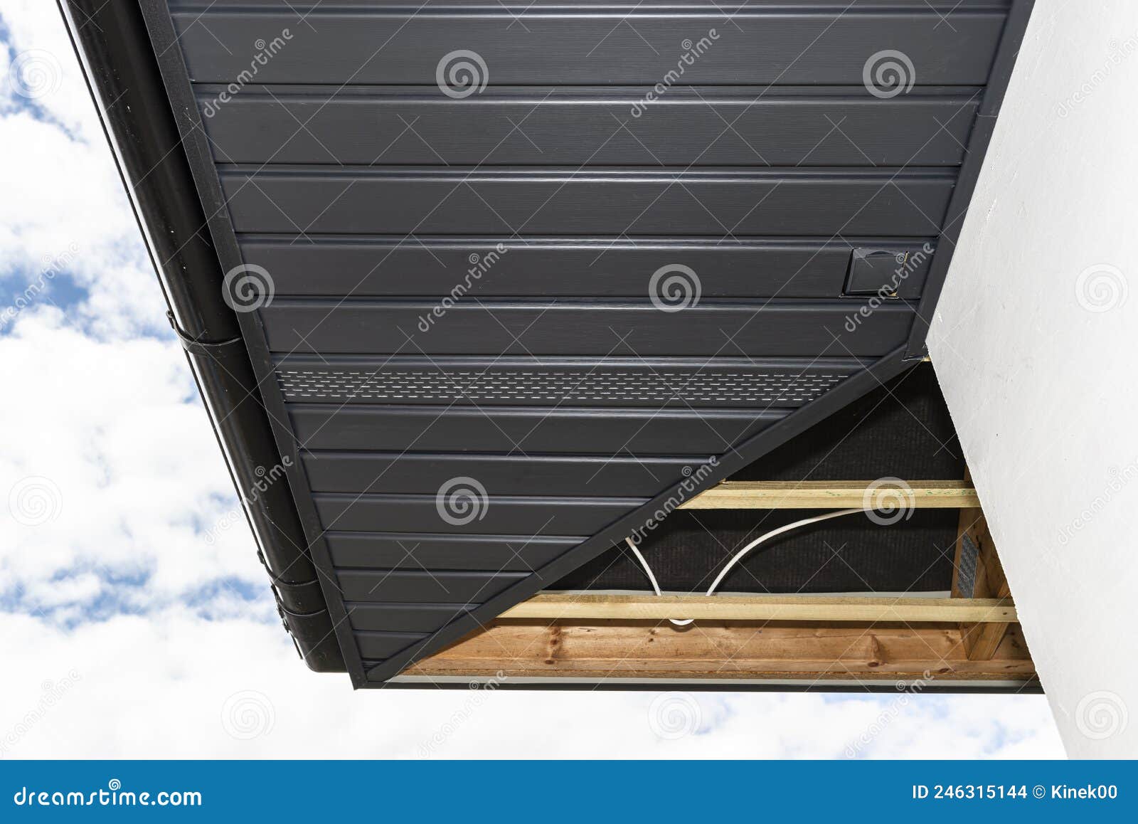 Scaffolding with Three Rows of Wooden Battens and a Modern Graphite ...