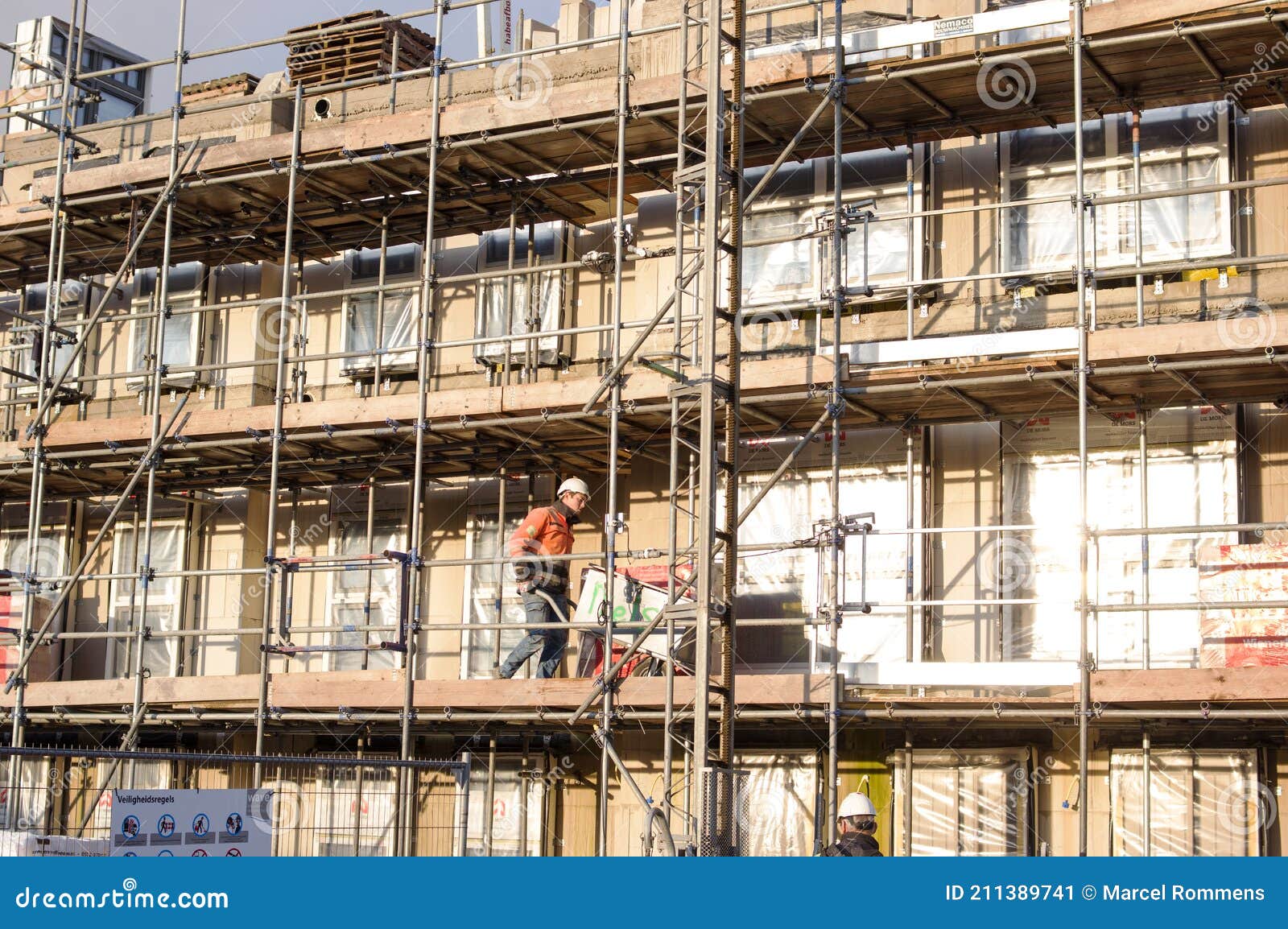 Scaffolding with an Worker at Work Editorial Photo - Image of male ...
