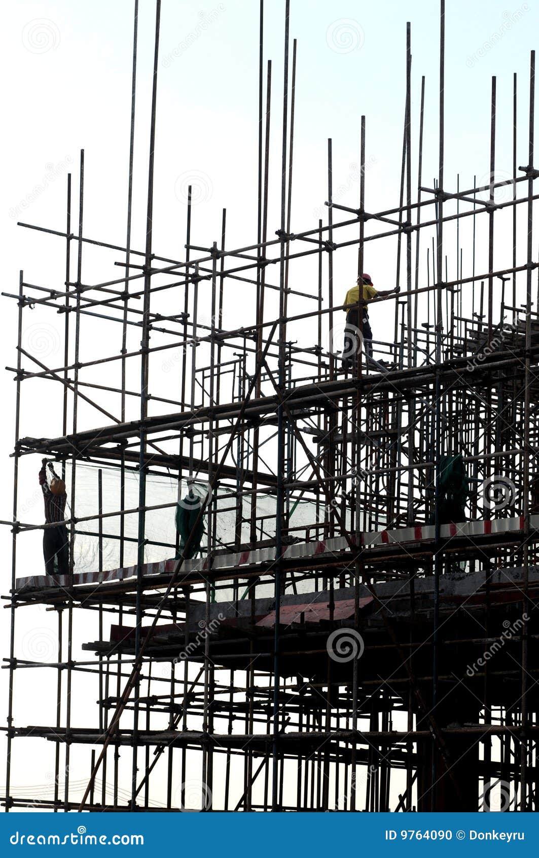 The scaffolds and workers stock photo. Image of plodding - 9764090