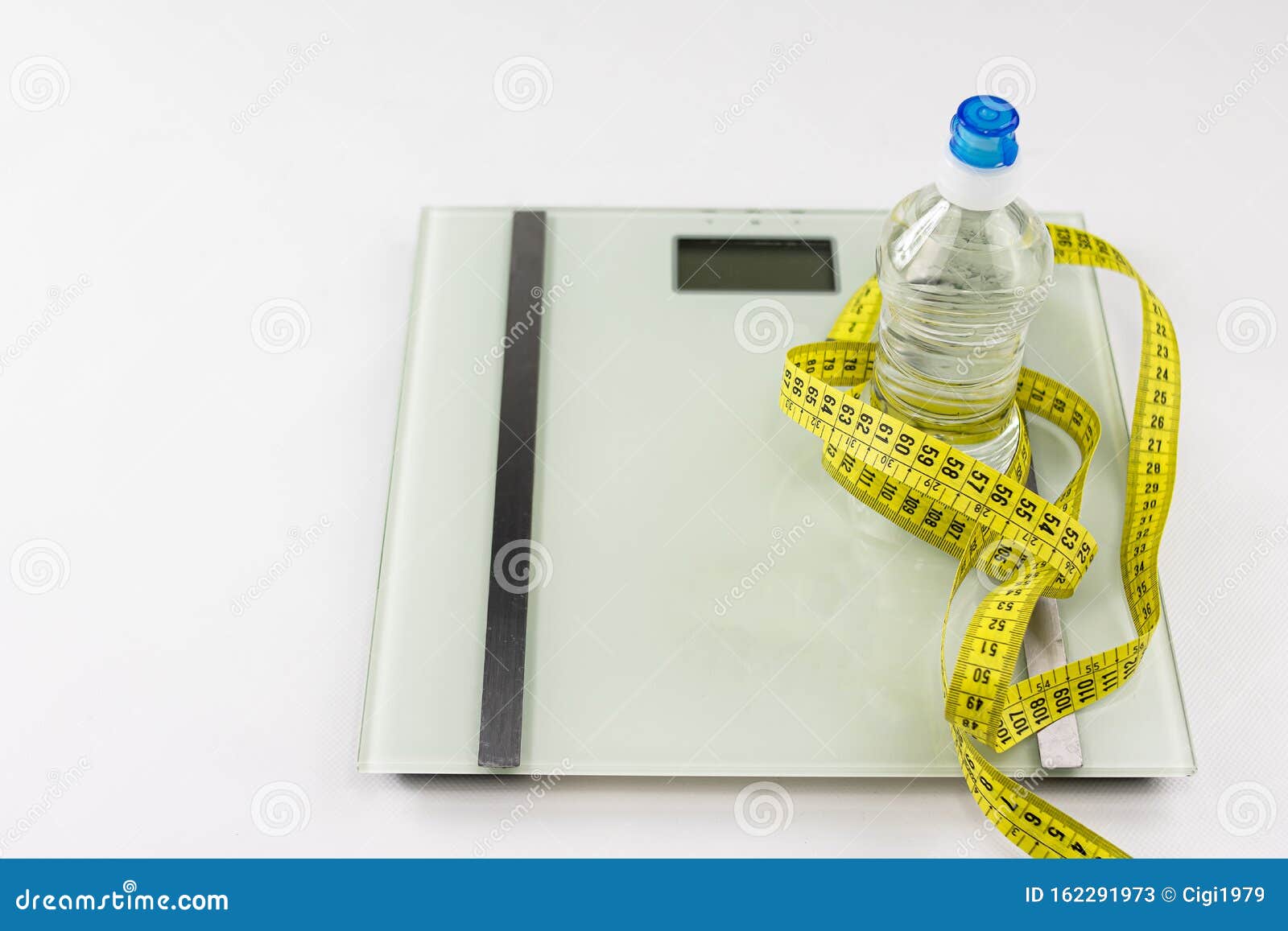 Scale for Dieting, Bottled Mineral Water and a Measuring Tape Stock ...