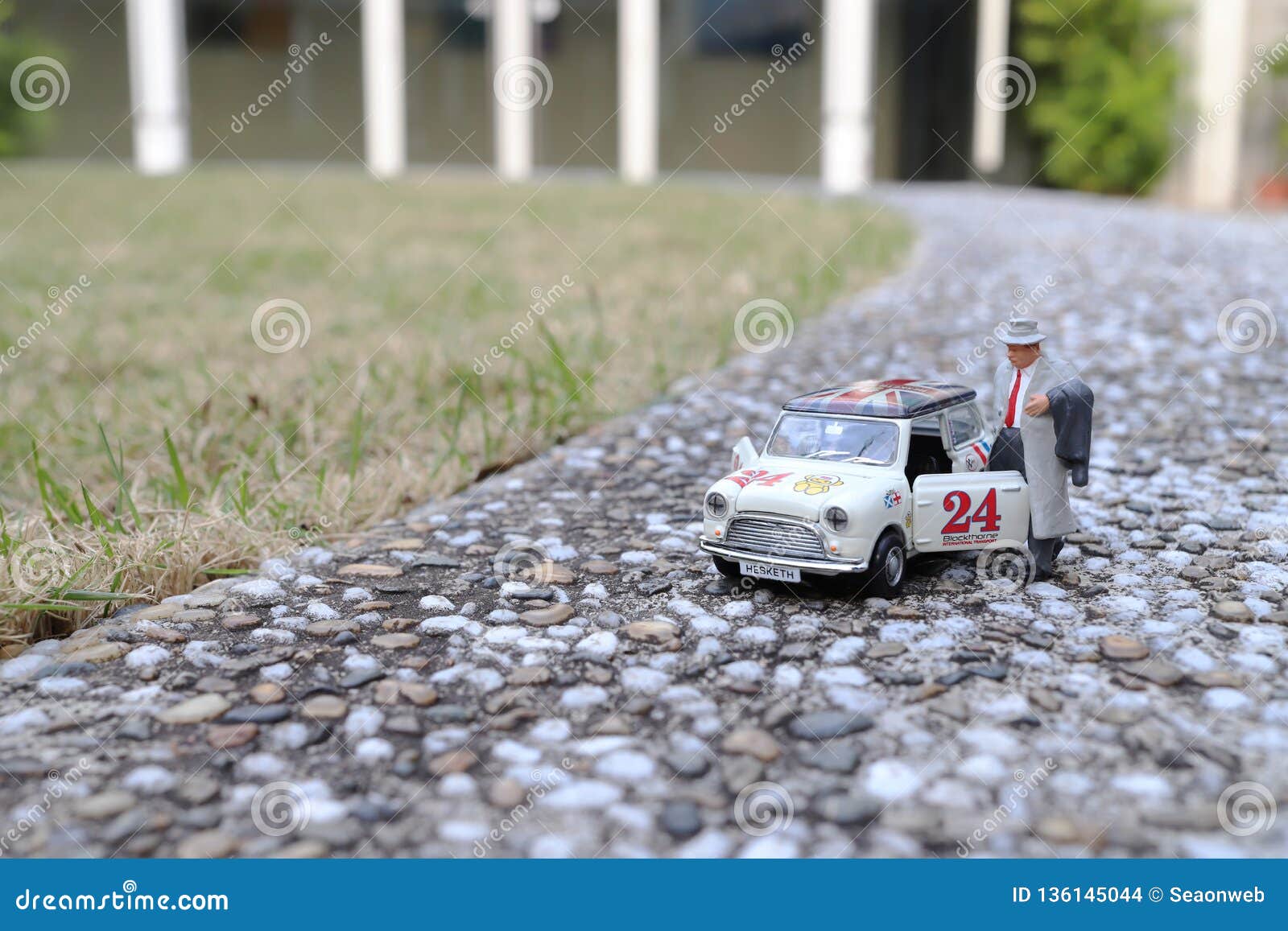 A Scale of Mini Cooper with Figure Editorial Stock Image - Image of ...