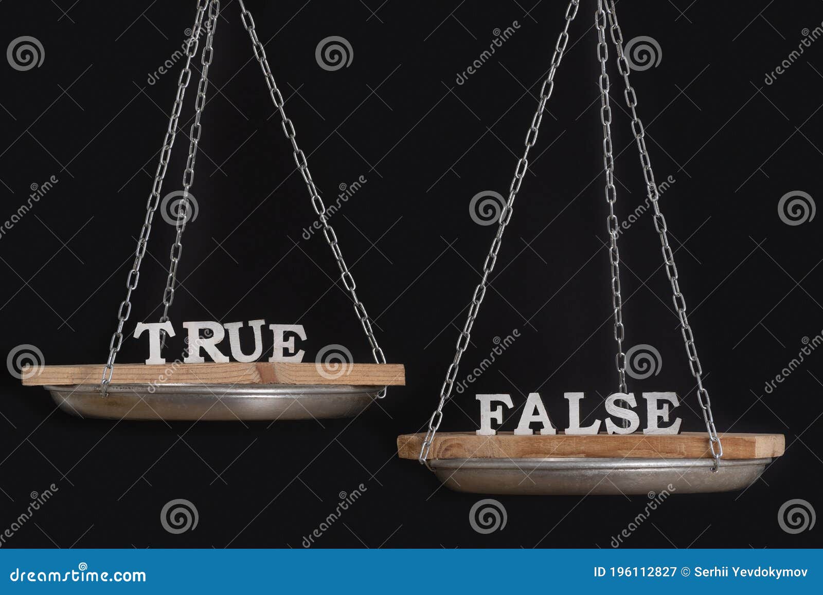 Scales with Truth and False. Balance on Black Background Close Up Stock ...