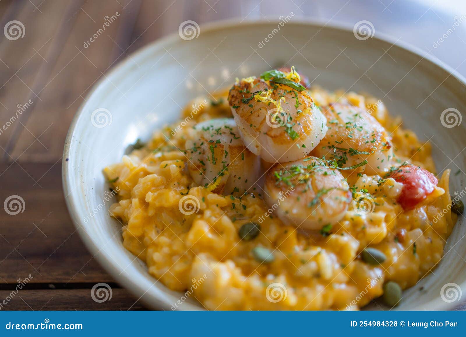 Scallop risotto dish stock photo. Image of lunch, sauce - 254984328