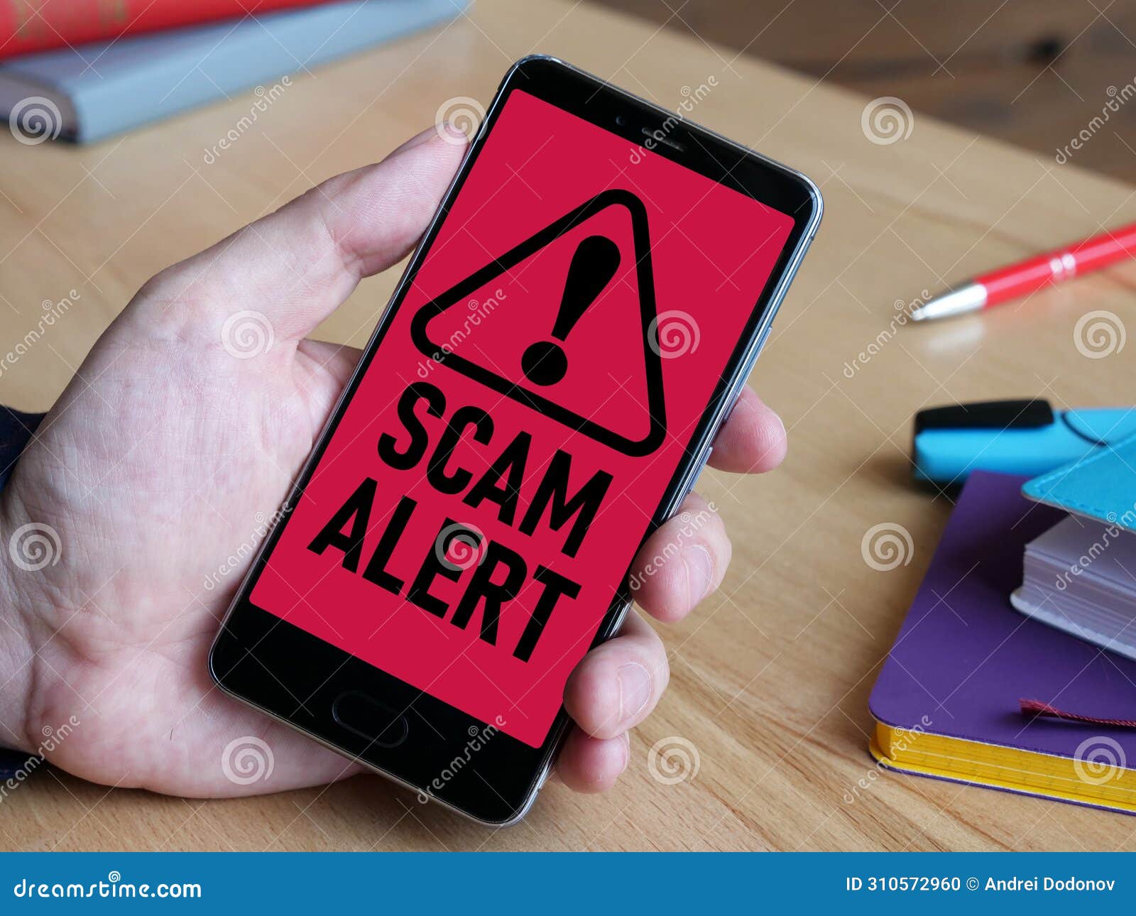 Scam Alert is Shown Using the Text on the Screen of Smartphone Stock ...