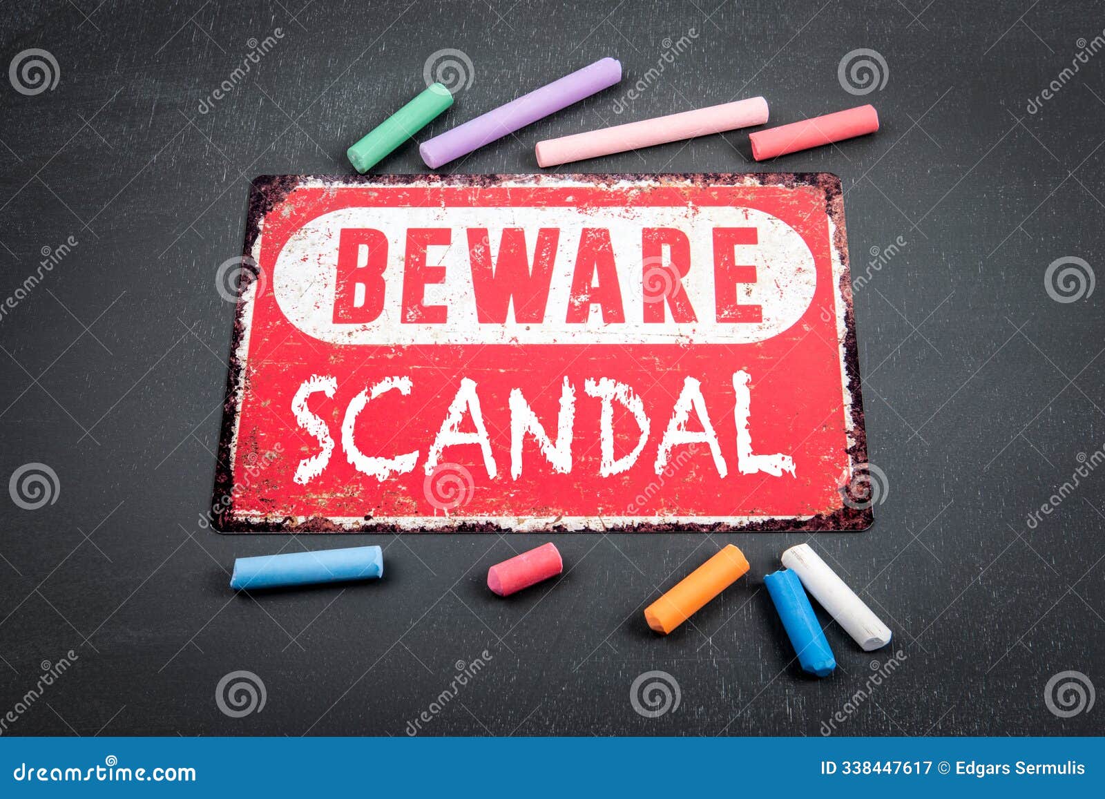 SCANDAL. Beware Sign with Text and Colored Pieces of Chalk on a Dark ...
