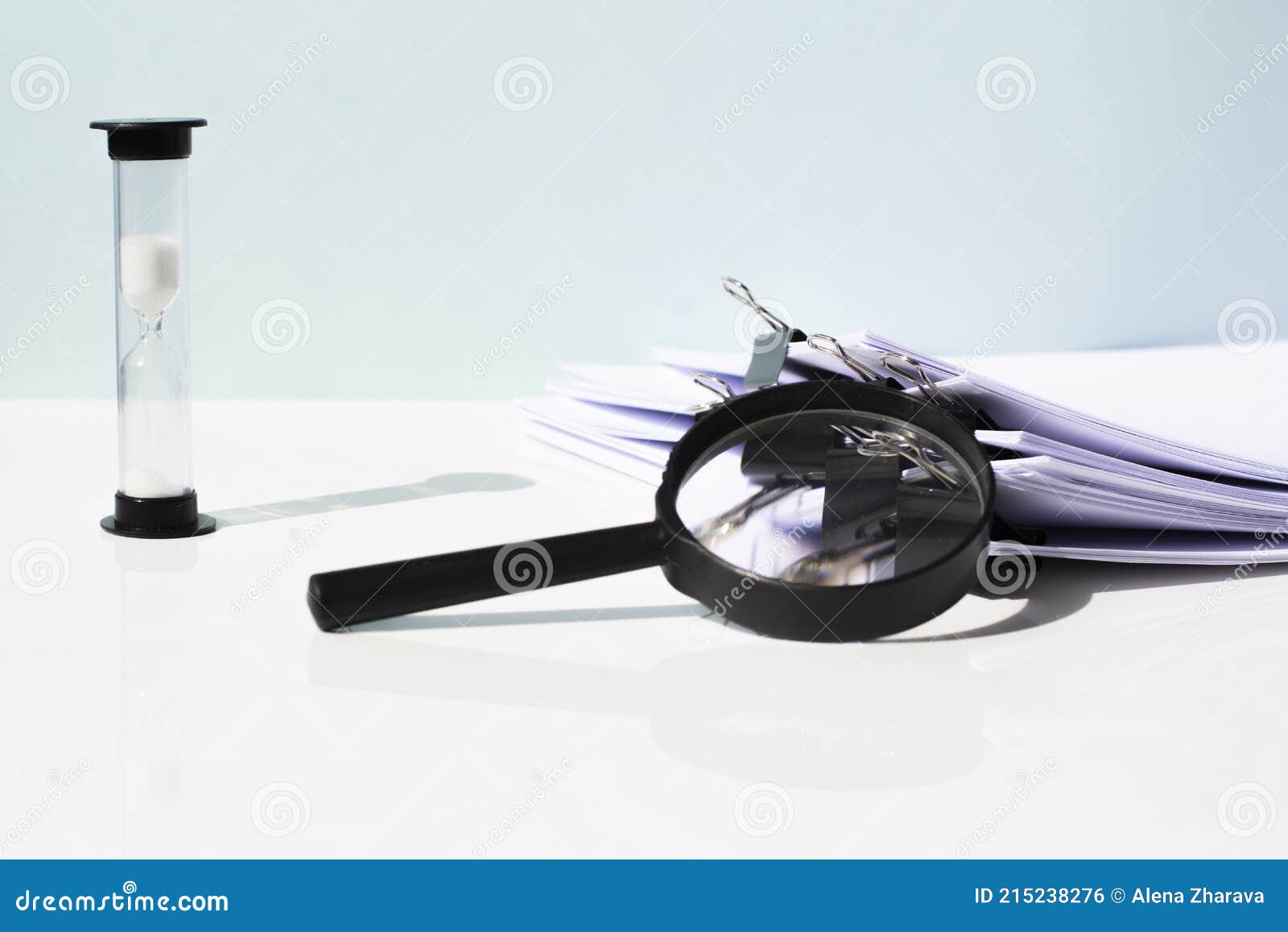 Scanning Business Documents. Magnifying Glass on the Stack of Documents ...