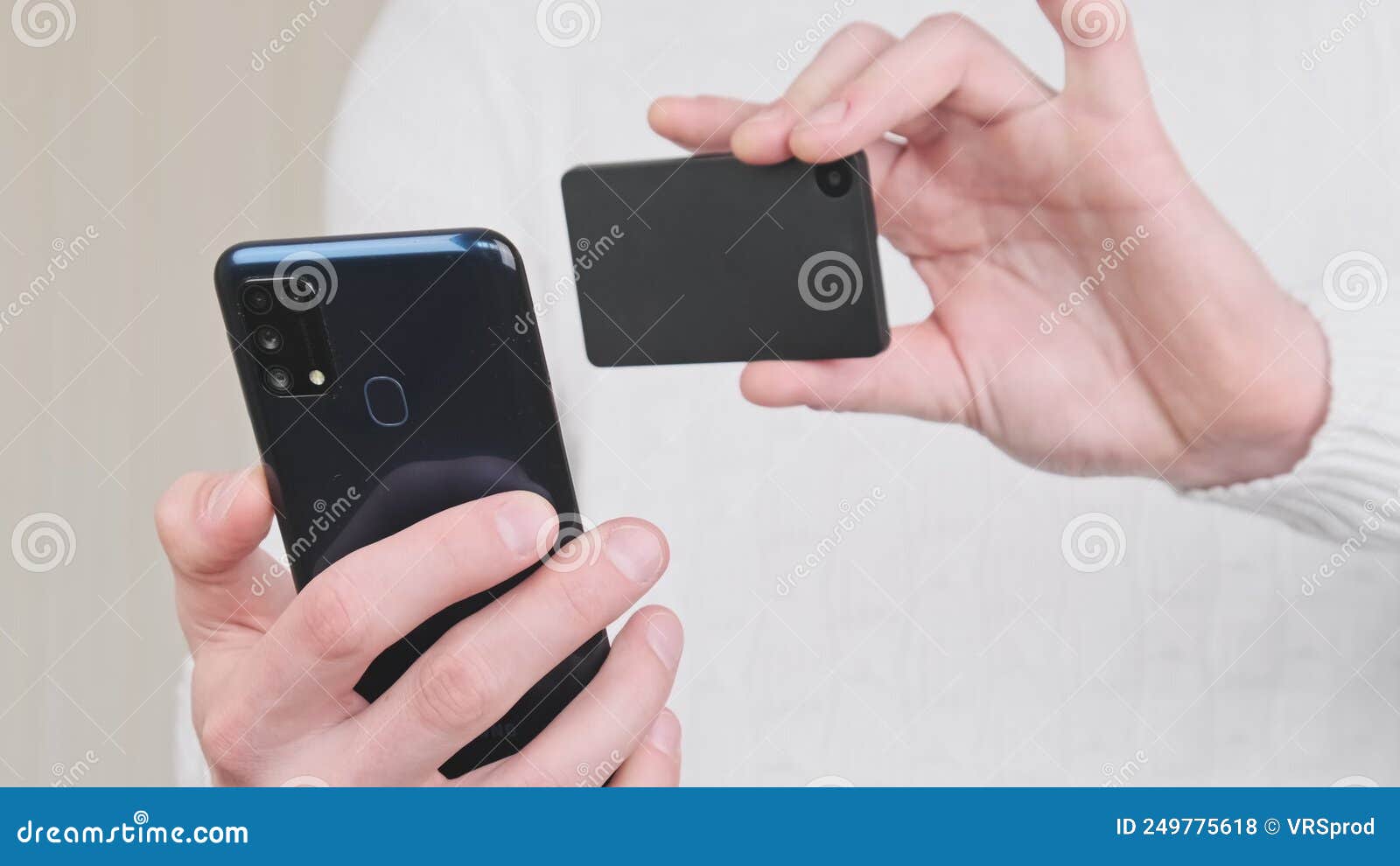 Scanning QR Code with a Modern Cold Crypto Wallet and Smartphone Stock ...