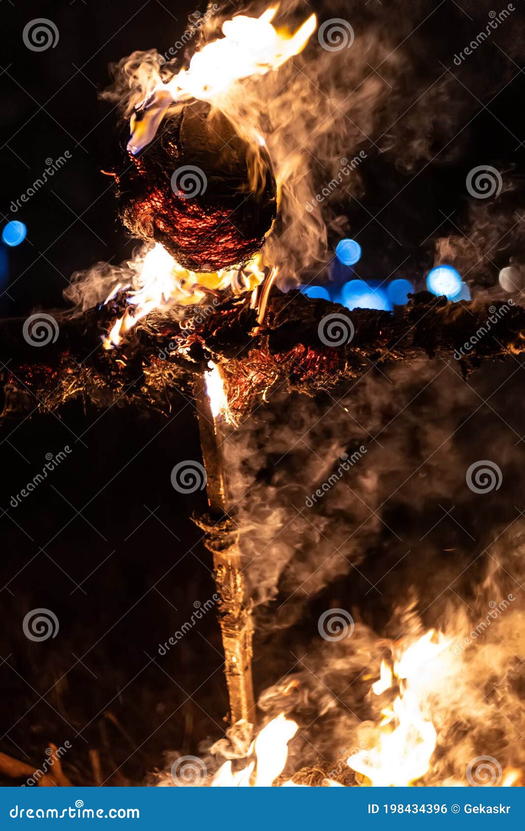 Scarecrow in festive fire stock photo. Image of creature - 198434396