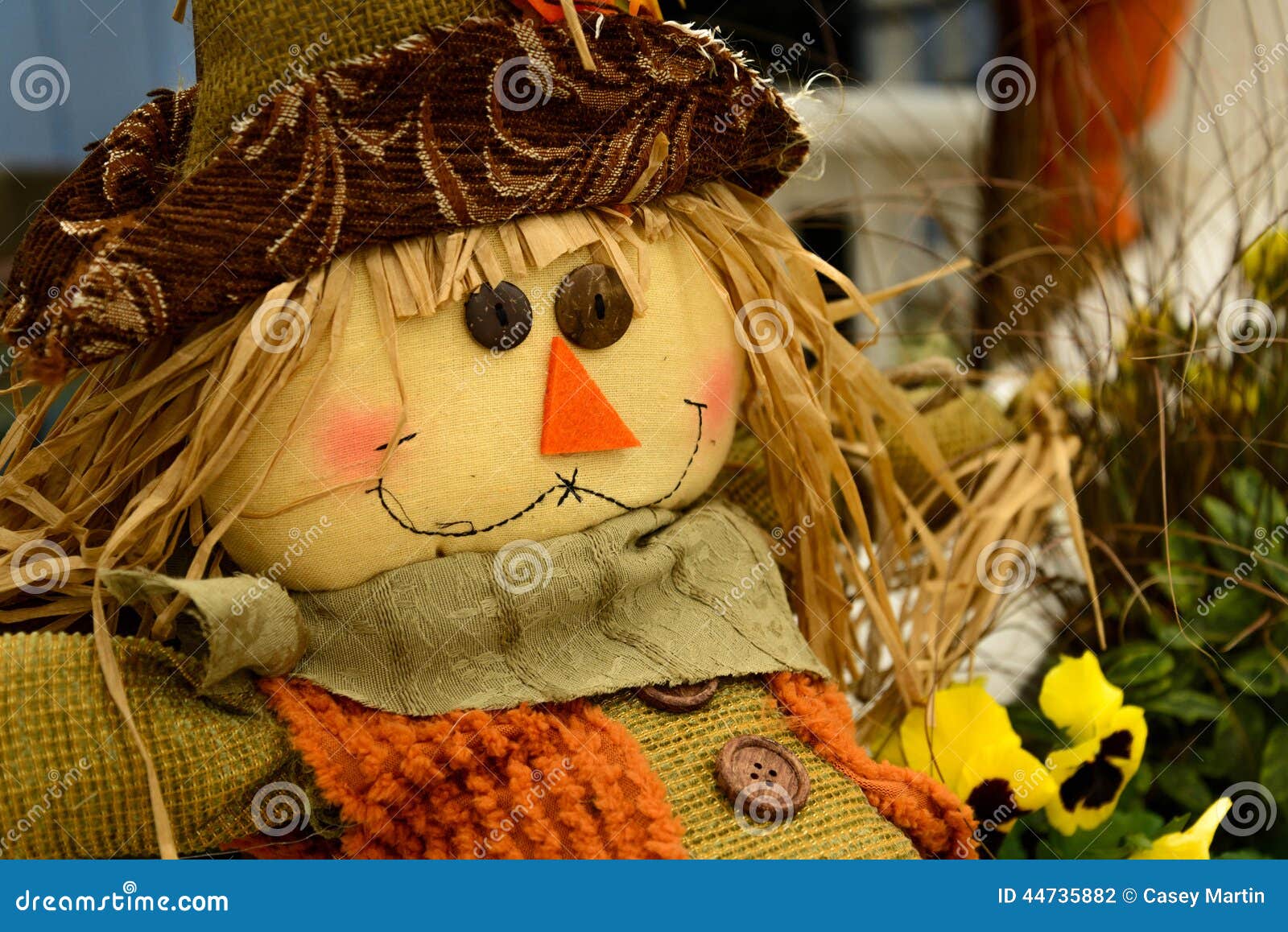 Scarecrows with Flowers and Hay Stock Photo - Image of scarecrow ...