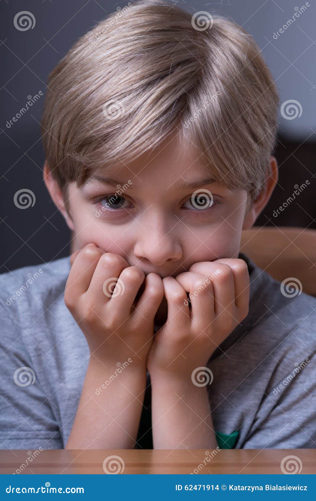 Scared boy biting nails stock photo. Image of male, scared - 62471914