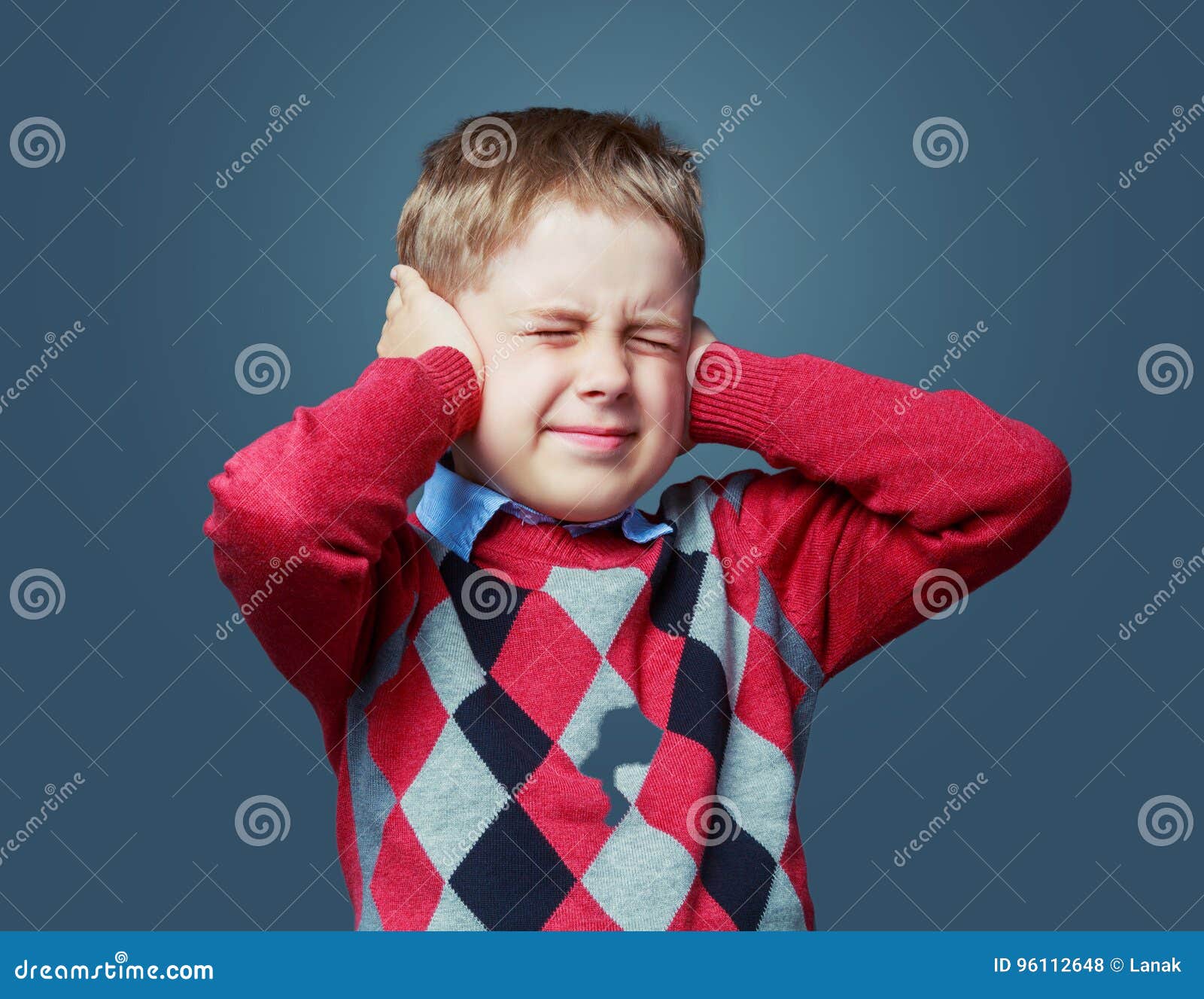Scared boy closing ears stock photo. Image of background - 96112648