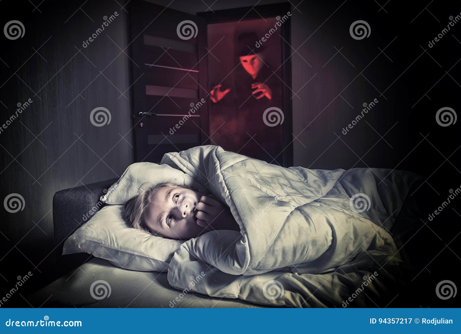 Scared Boy Lying in the Bed while the Masked Stranger Stock Image ...