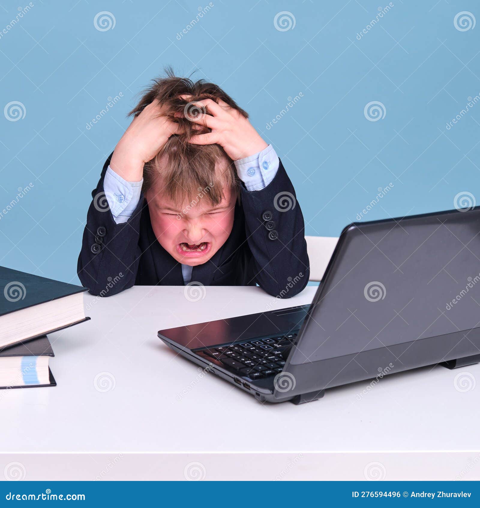 A Scared Boy in a School Suit on Distance Learning, Copy Space on a Blu ...