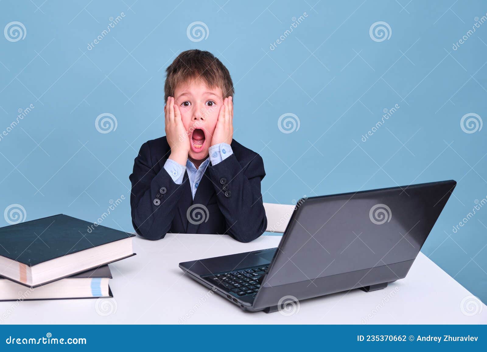 A Scared Boy in a School Suit on Distance Learning, Copy Space on a ...