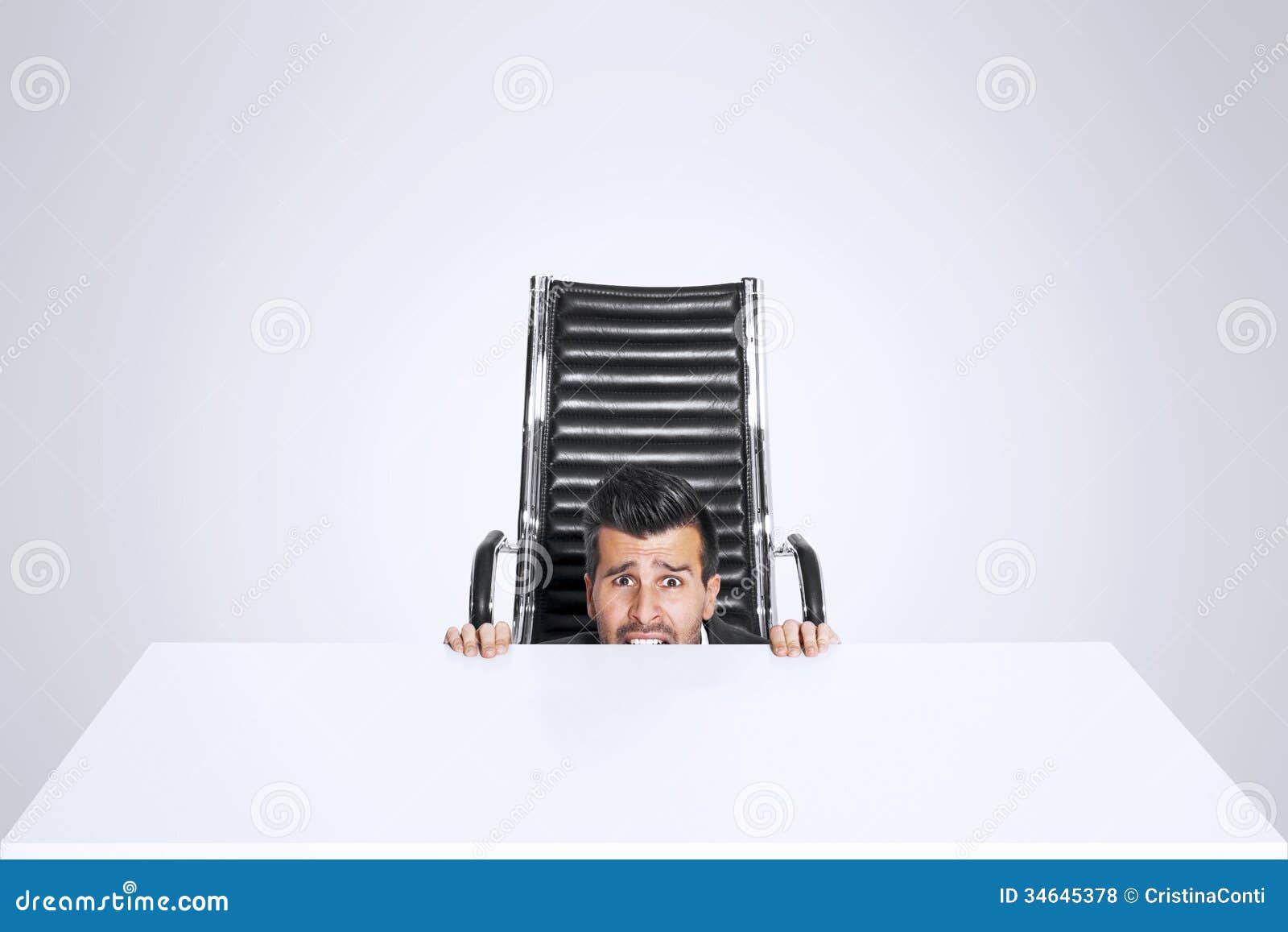 Scared Business Man Hide Himself Under the Office Desk Stock Photo ...