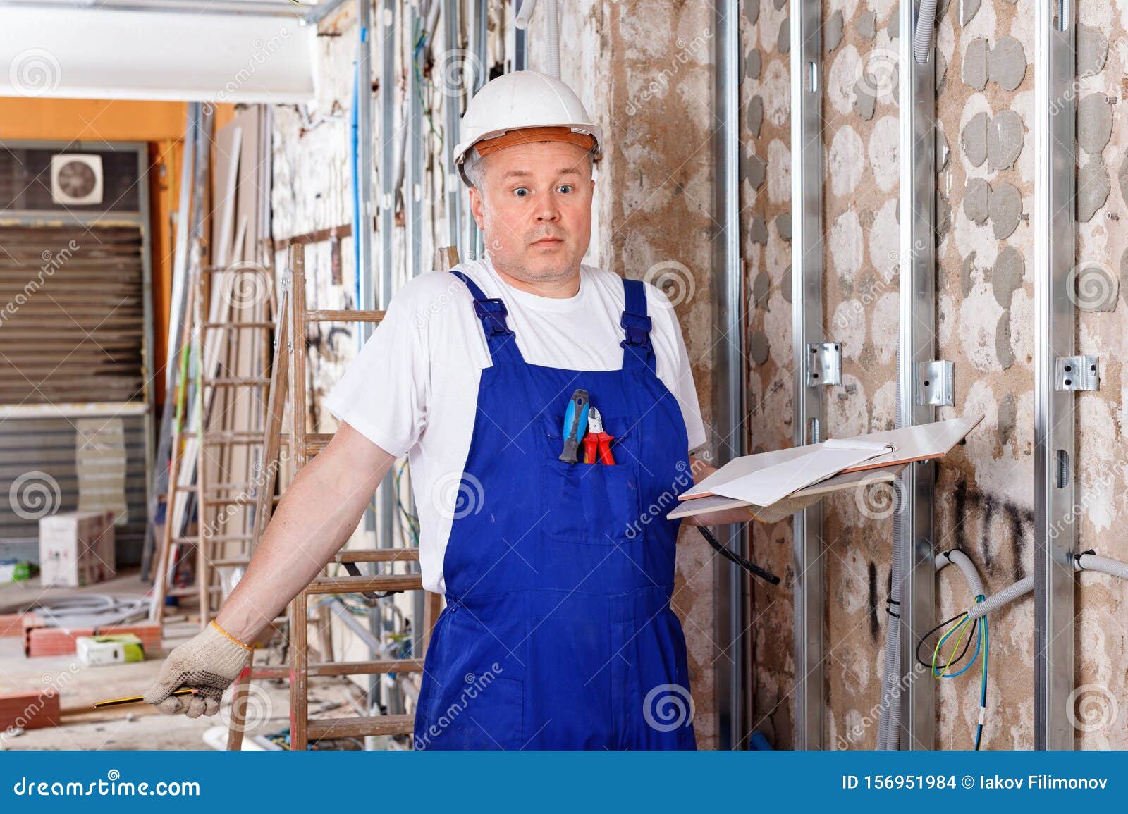 Scared and Confused Male Contractor Looking at Room and Determining ...