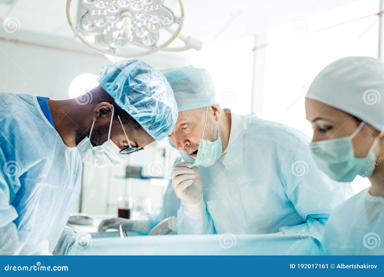 Scared Doctor is Looking at the Patient during the Operation Stock ...