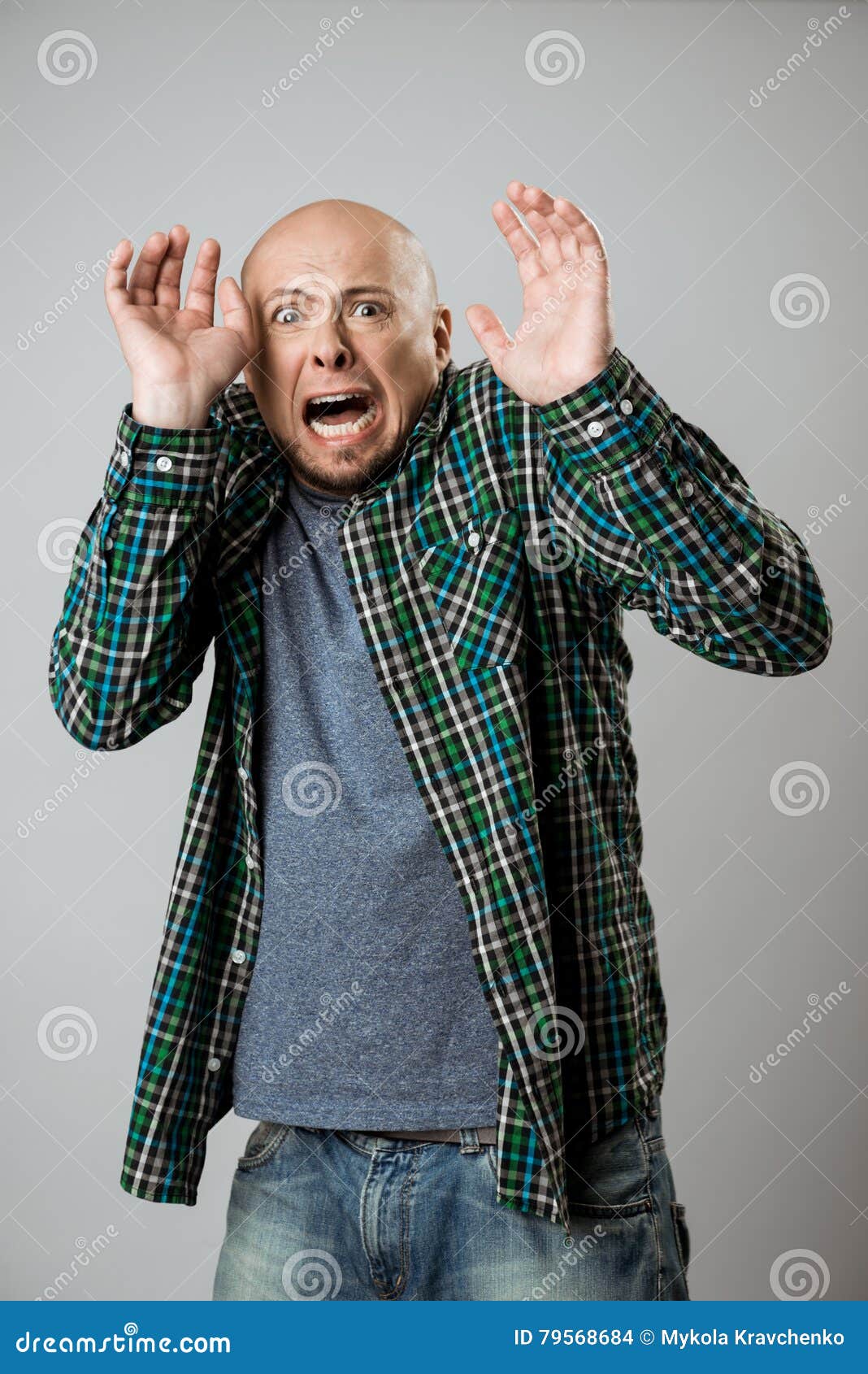 Scared Emotive Young Man Shouting Over Beige Background. Stock ...
