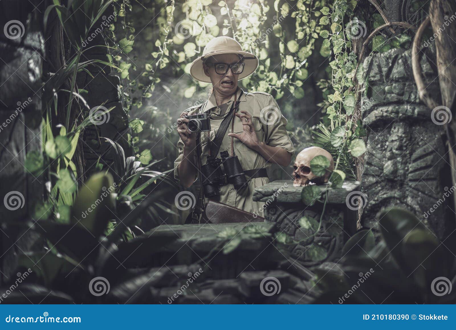 Scared Explorer Finding a Skull in the Jungle Stock Photo - Image of ...