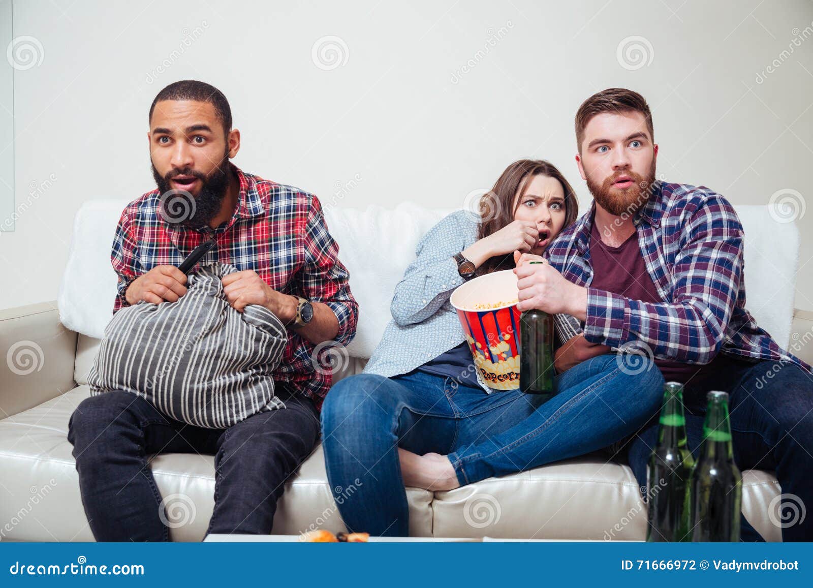 Scared Friends Sitting on Sofa and Watching Tv Stock Photo - Image of ...