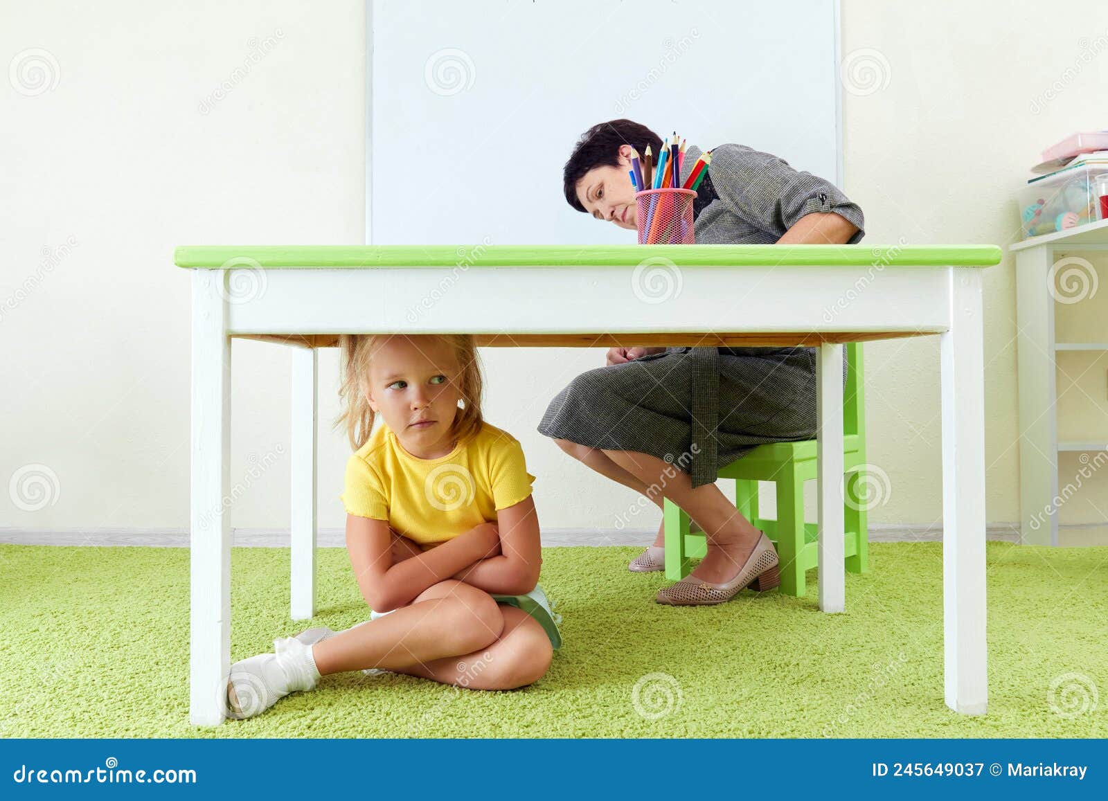Scared Girl Hiding Under Table Sitting on a Floor Stock Image - Image ...