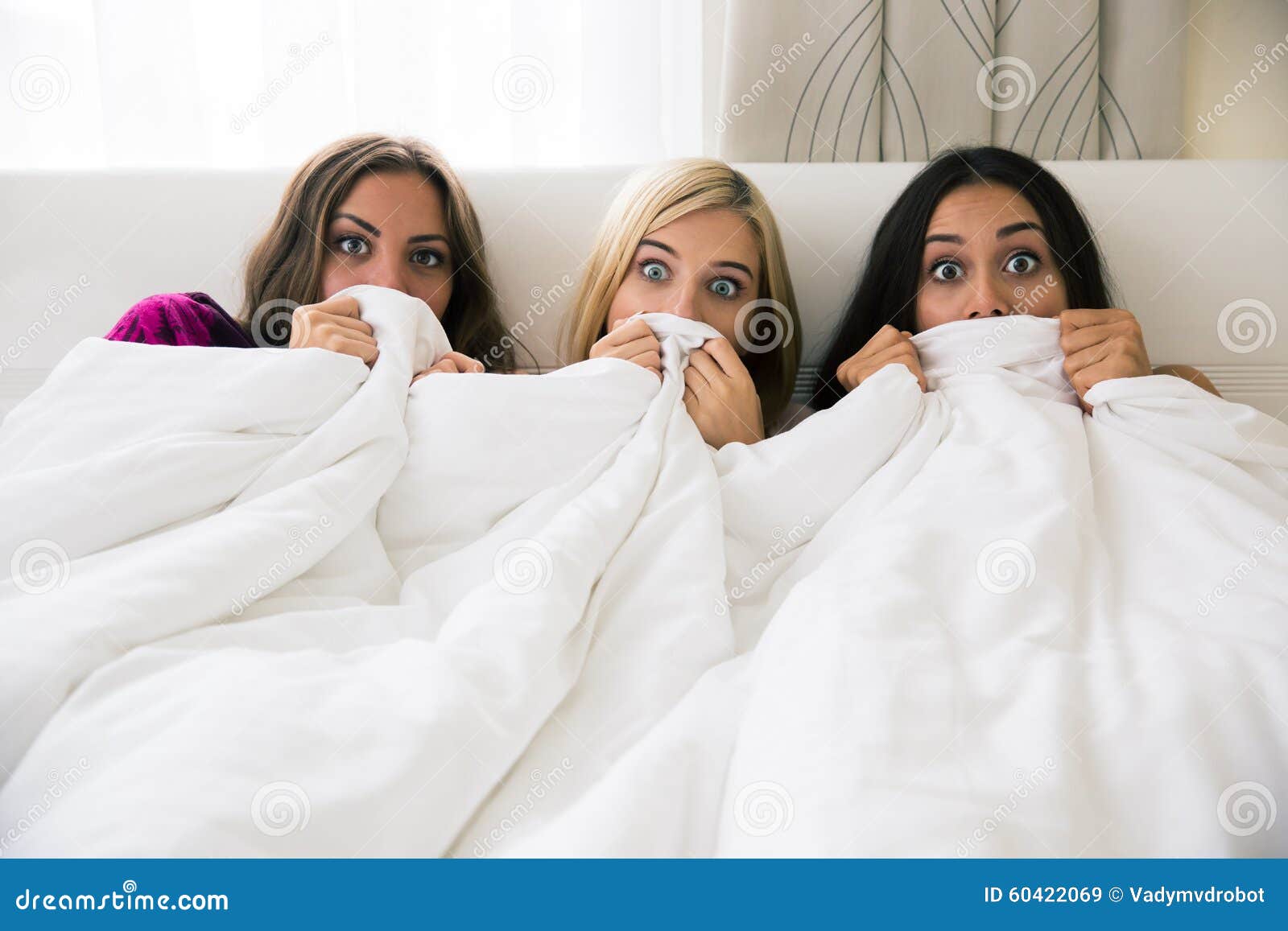 Scared Girlfriends Covering Their Face with Blanket Stock Image - Image ...