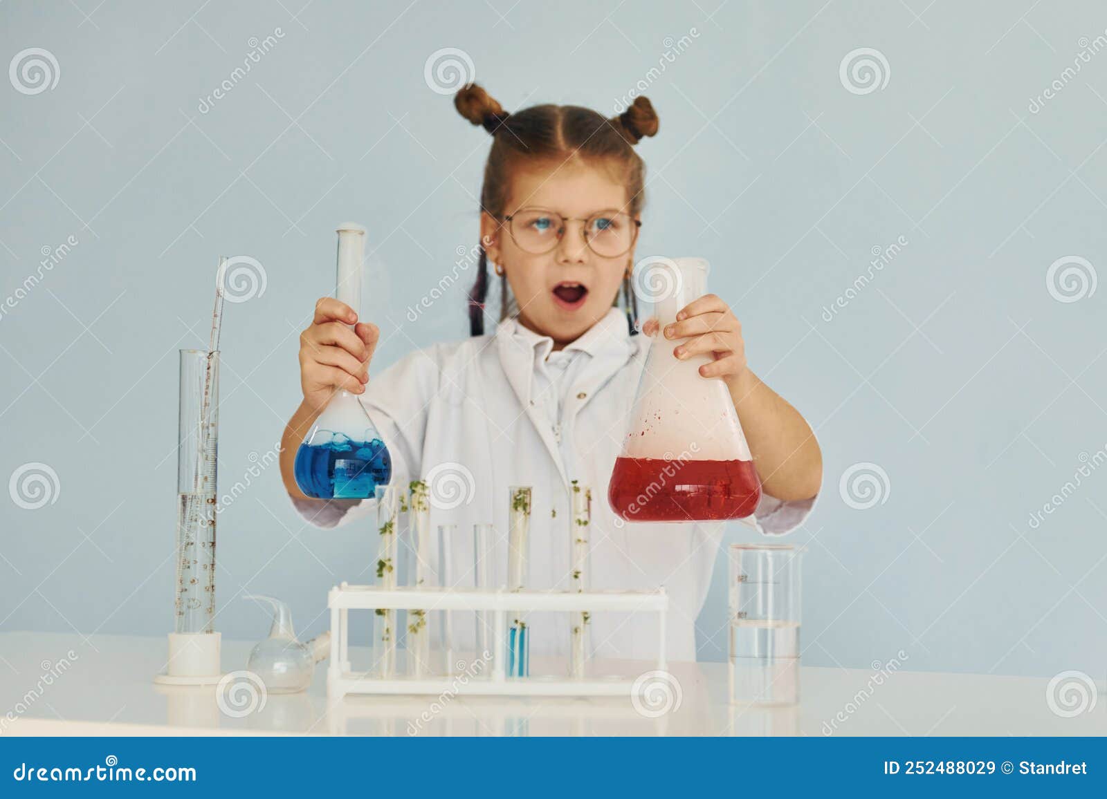Scared Little Girl in Coat Playing a Scientist in Lab by Using ...