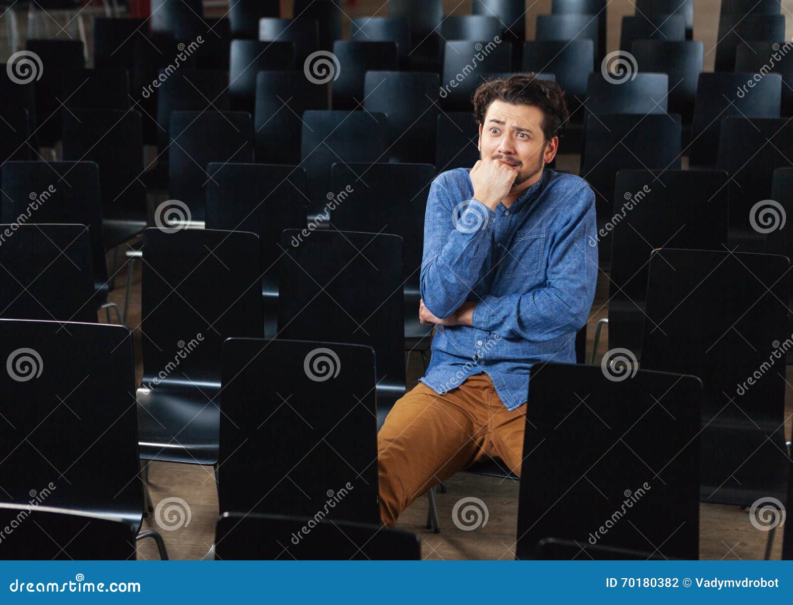 Scared Man Sitting in Conference Hall Stock Photo - Image of alone ...