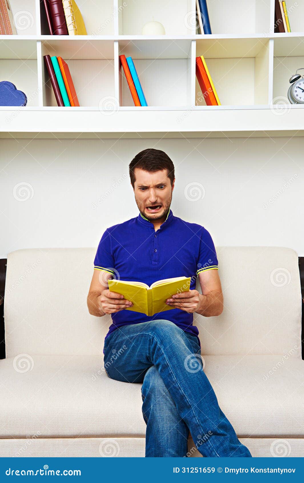 Scared man sitting on sofa stock image. Image of resting - 31251659