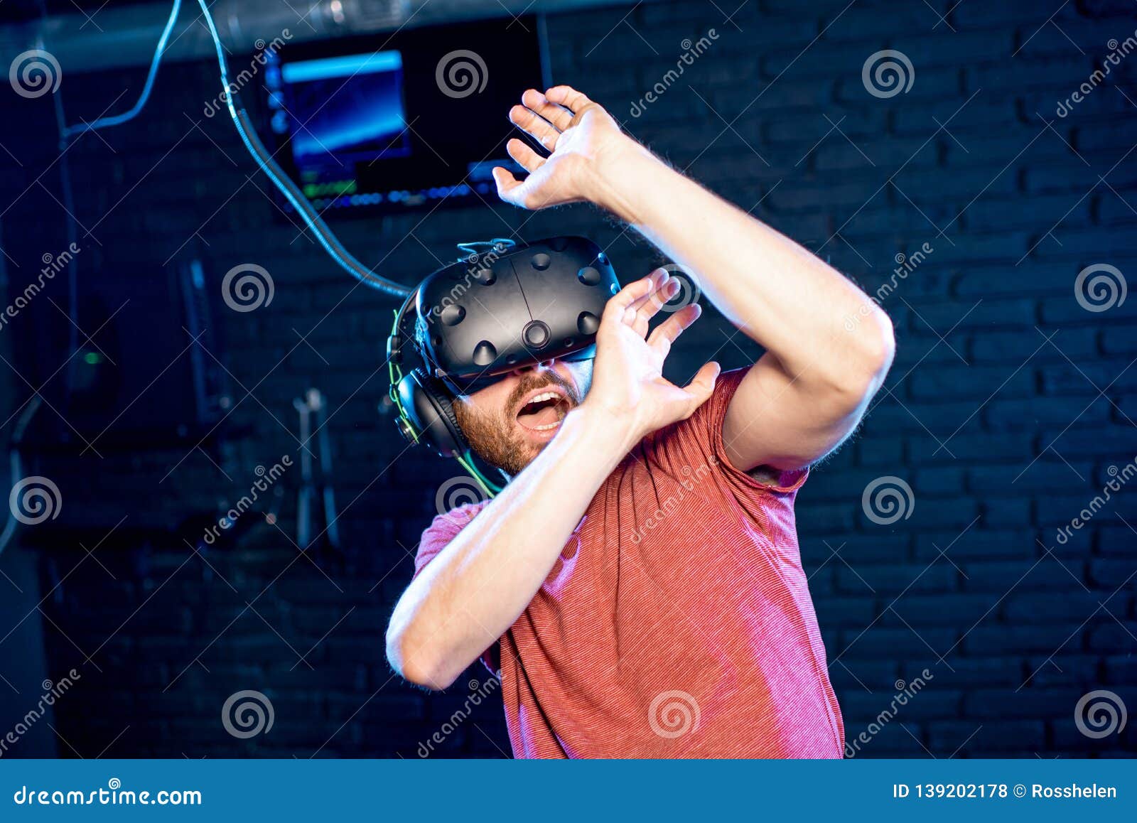 Scared Man Using Virtual Reality Headset Stock Photo - Image of room ...