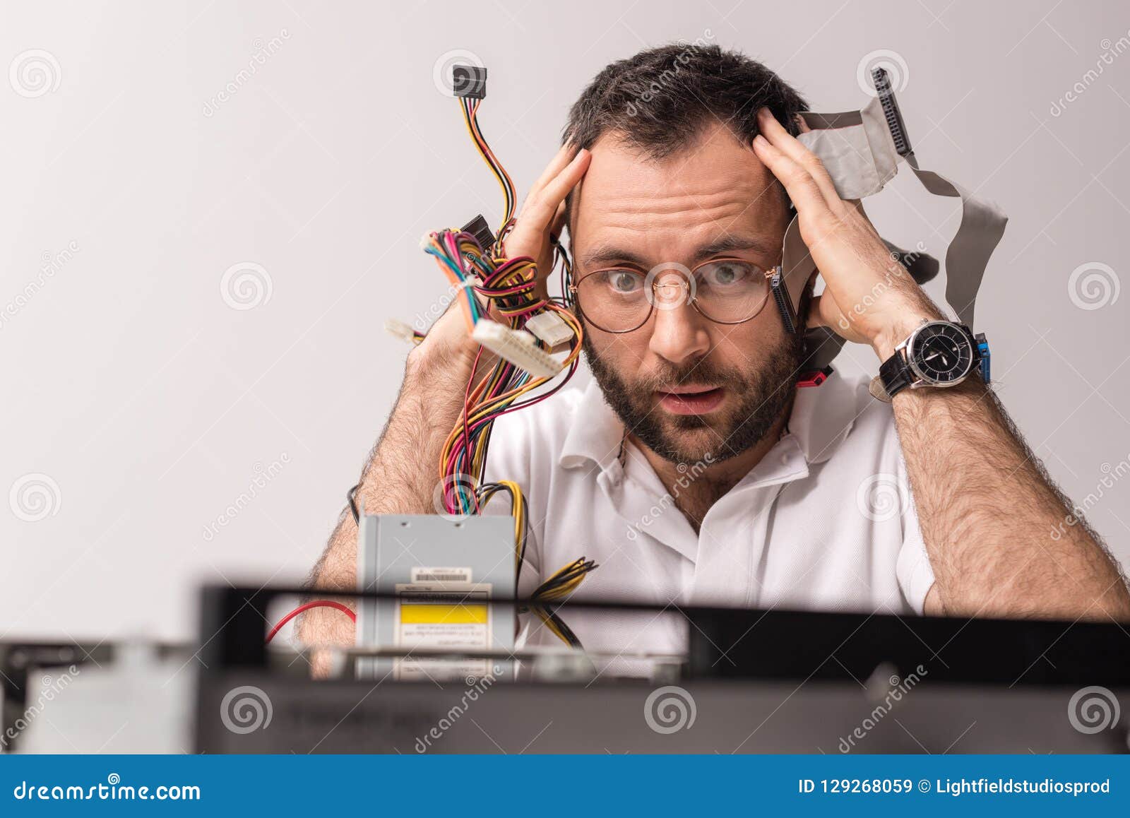 Scared Man with Wires in Hands Near His Head Looking Stock Image ...