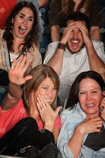 Scared People in Theater stock image. Image of entertainment - 24252611