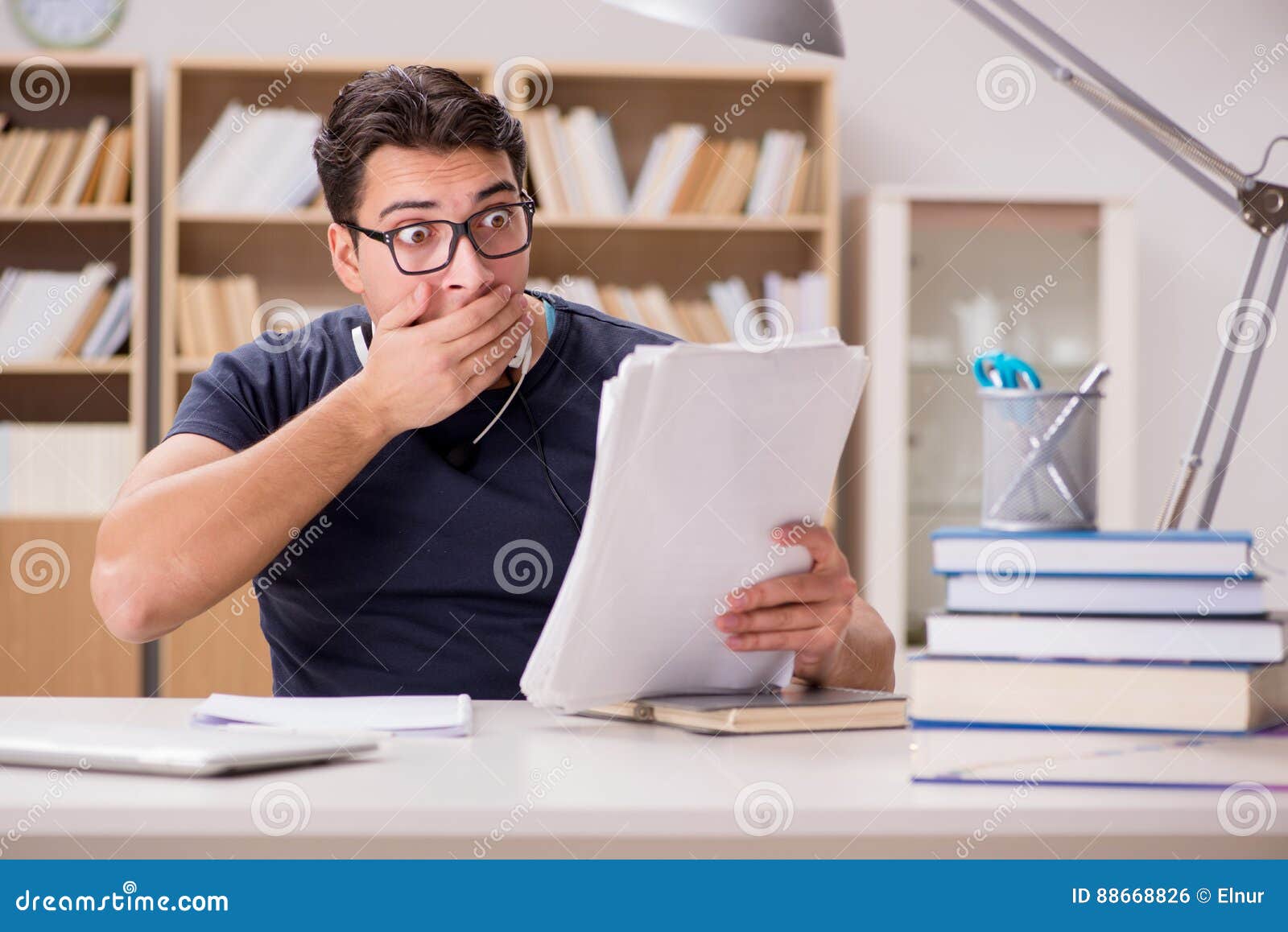 The Scared Student with Paperwork in Library Stock Photo - Image of ...