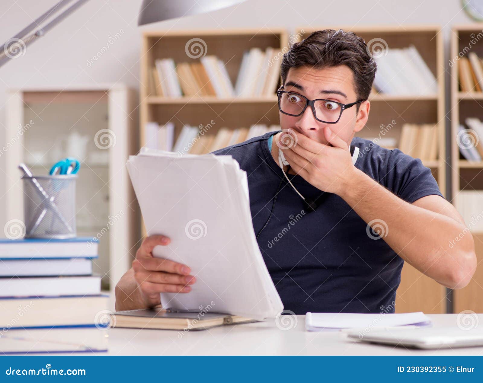 Scared Student with Paperwork in Library Stock Image - Image of school ...
