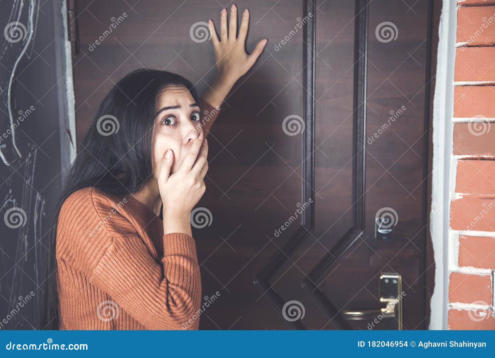 Scared woman hand on door stock photo. Image of burglar - 182046954