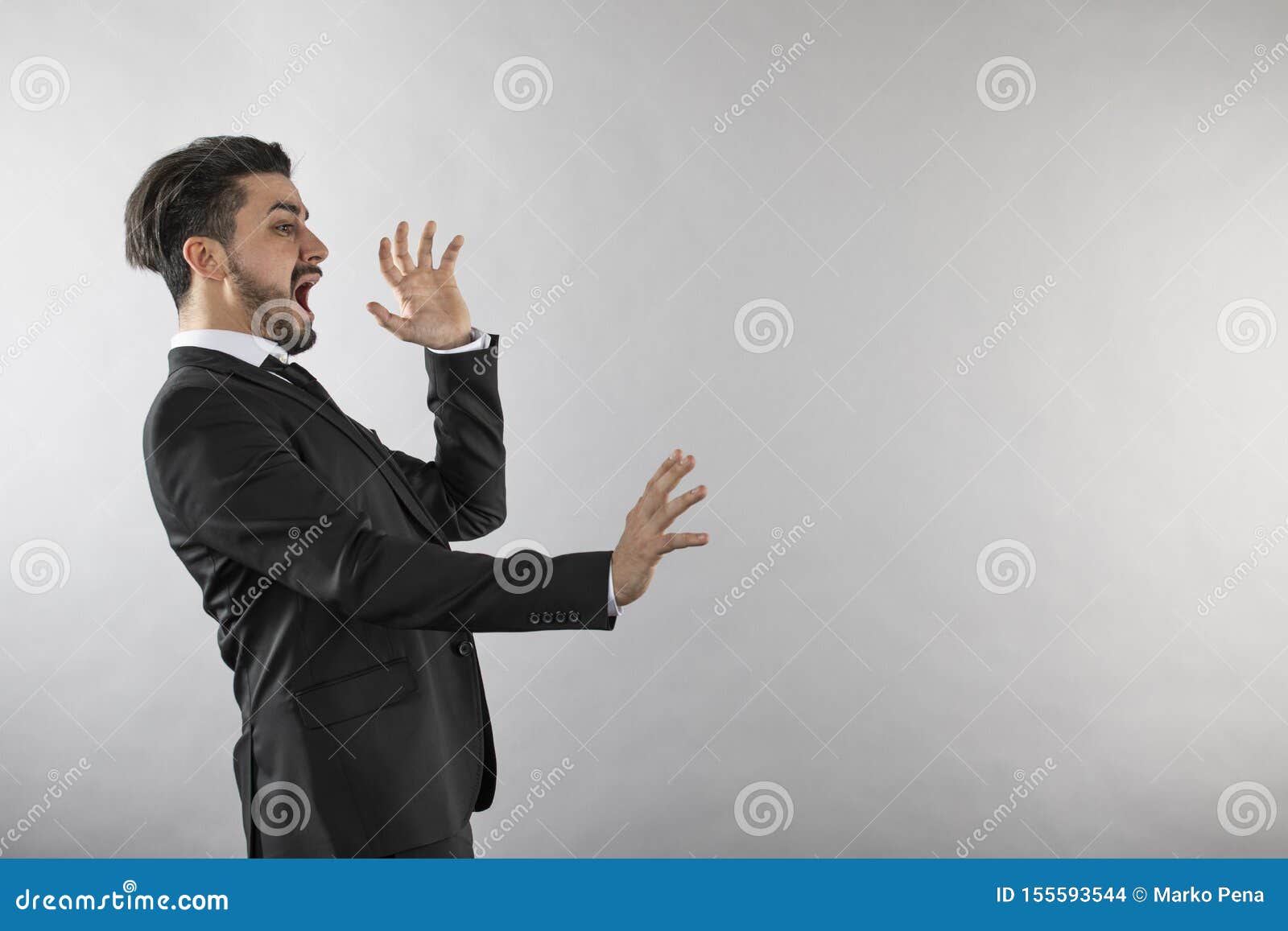 Scared Young Businessman Pulling Back from Something Stock Photo ...