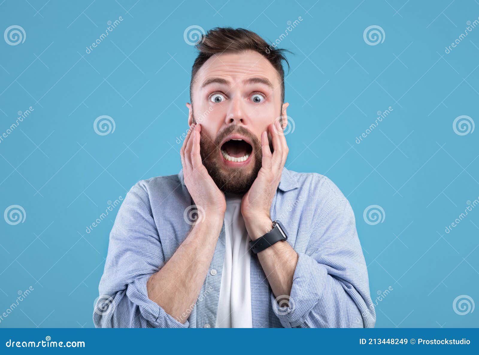 Scared Young Guy Screaming in Panic Over Blue Studio Background Stock ...