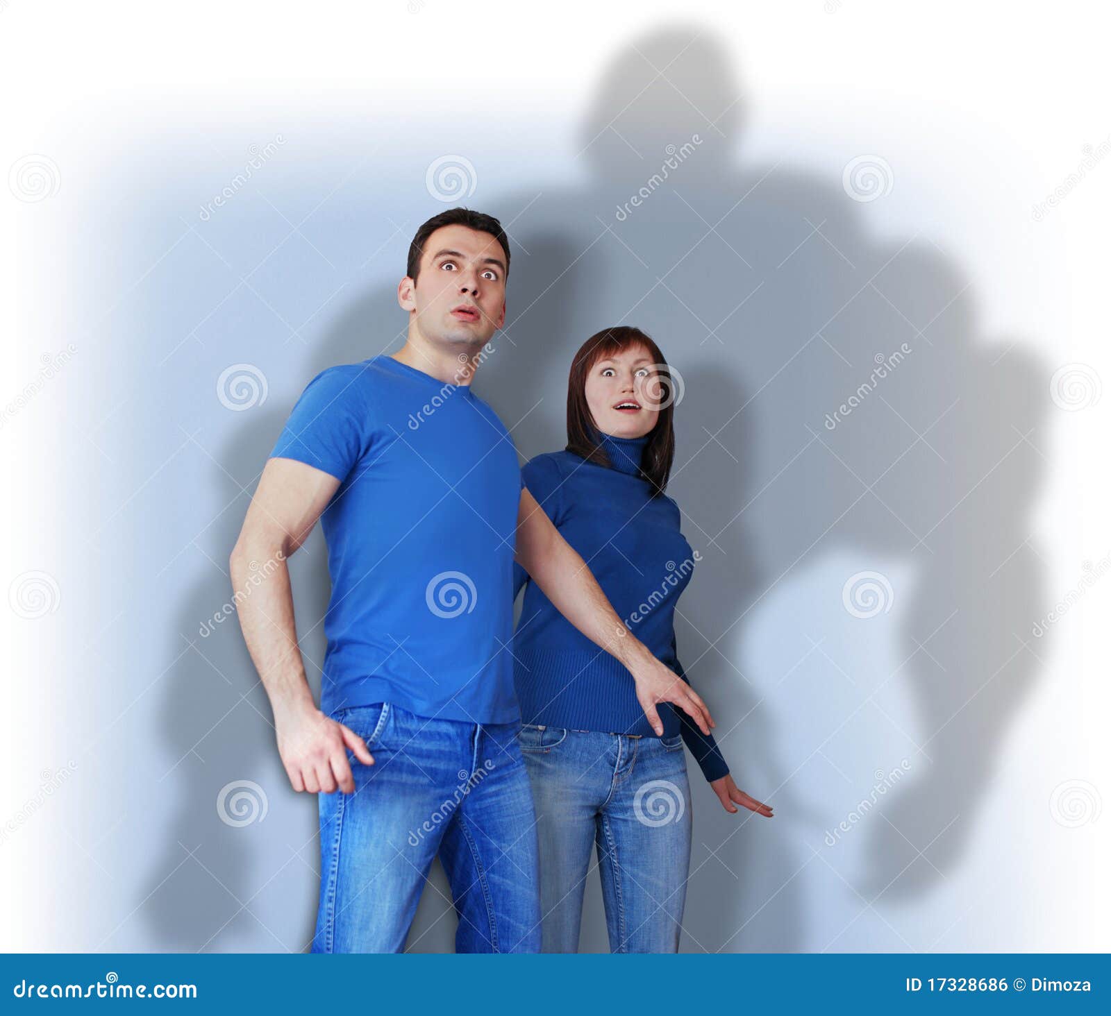 Scared Young Man and Woman in Blue Wear Stock Photo - Image of despair ...