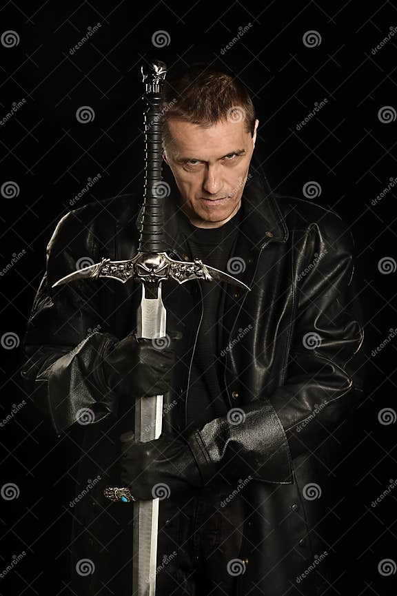 Scary assassin with sword stock photo. Image of assassin - 42020558