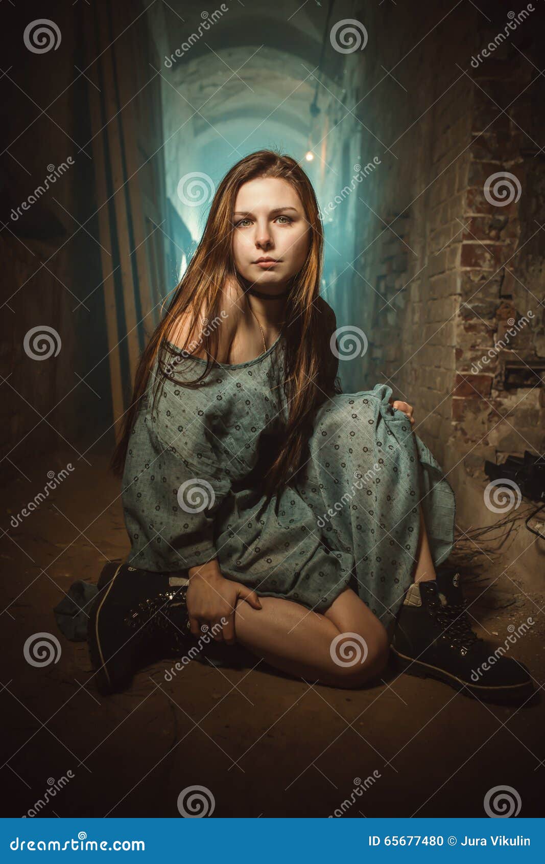 In a scary basement stock photo. Image of brunette, scary - 65677480