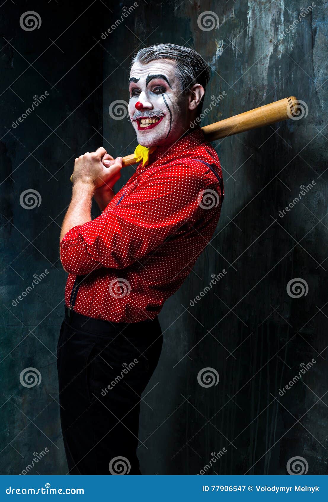 The Scary Clown and Baseball-bat on Dack Background. Halloween Concept ...