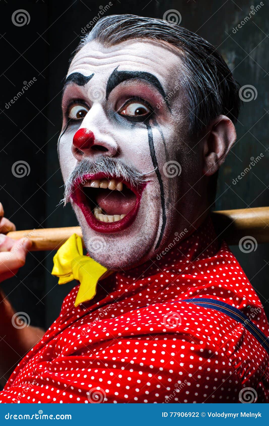 The Scary Clown and Baseball-bat on Dack Background. Halloween Concept ...