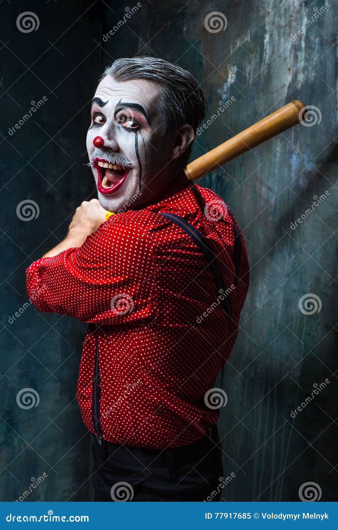 The Scary Clown and Baseball-bat on Dack Background. Halloween Concept ...