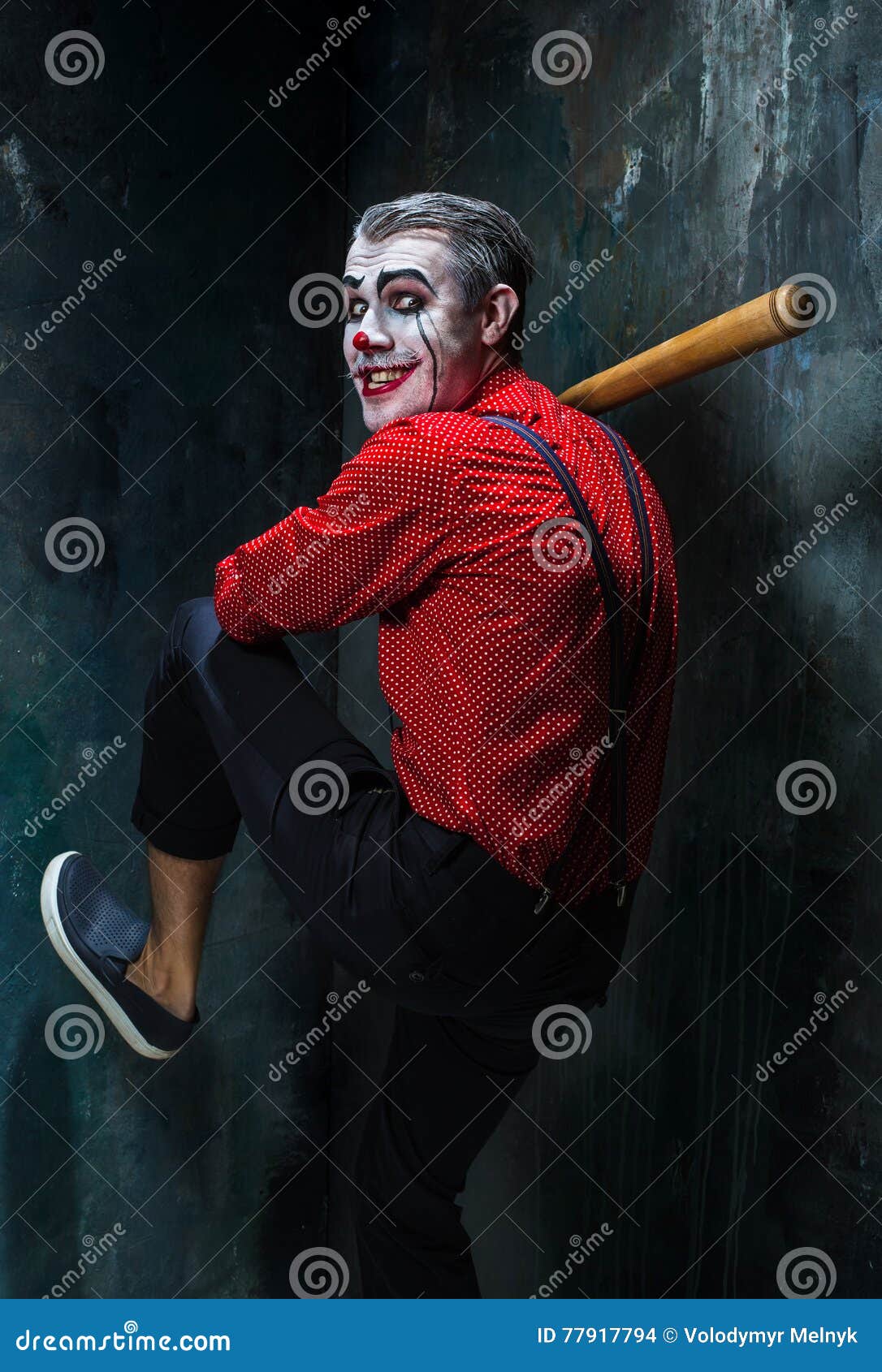 The Scary Clown and Baseball-bat on Dack Background. Halloween Concept ...