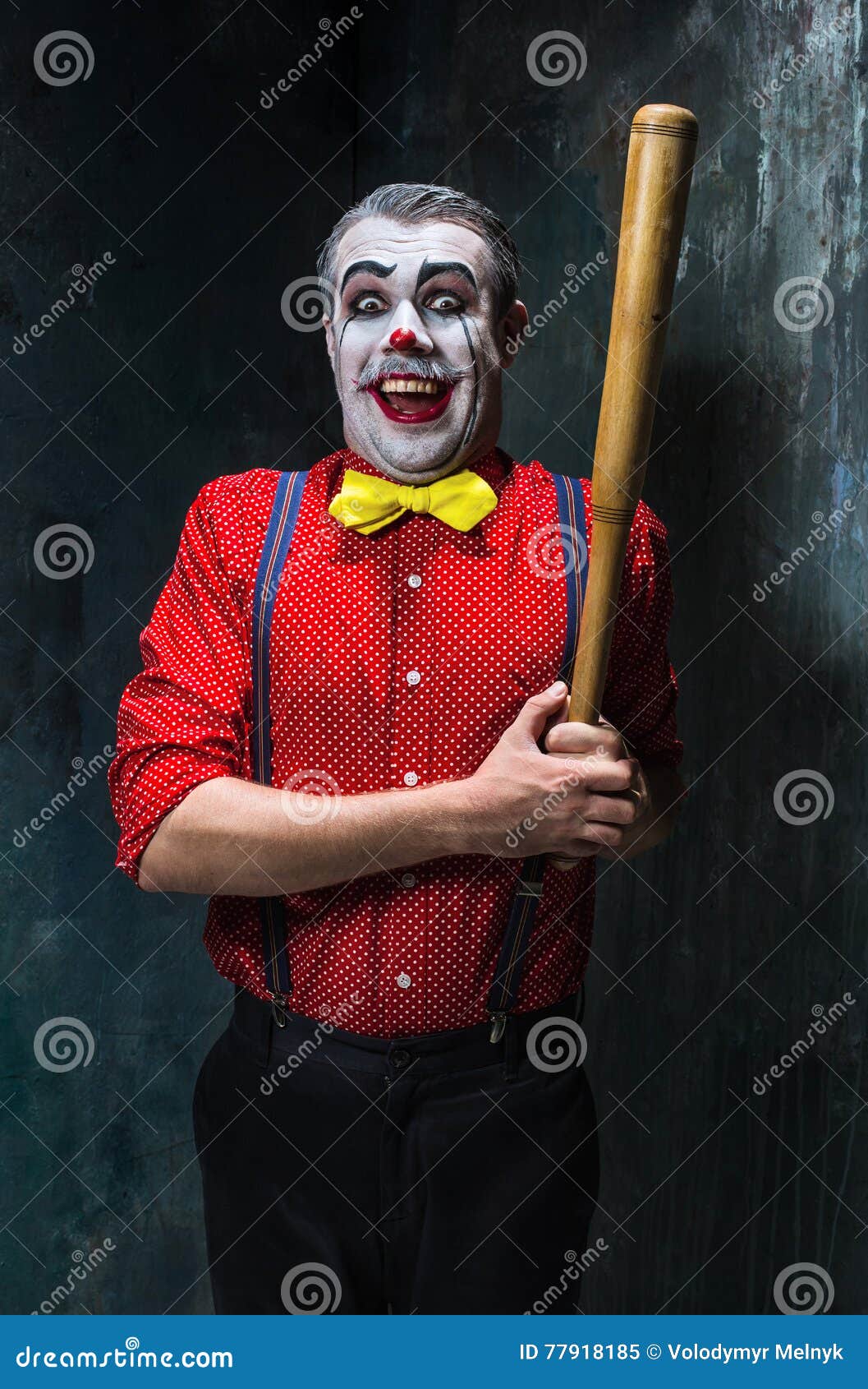 The Scary Clown and Baseball-bat on Dack Background. Halloween Concept ...