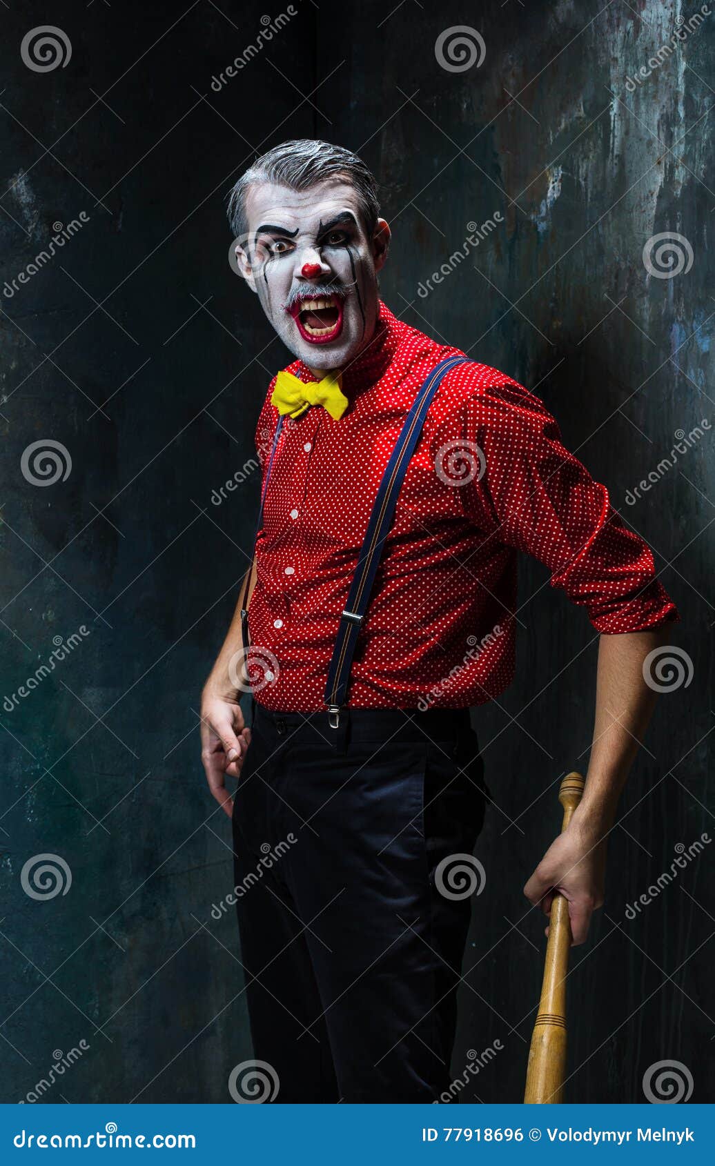 The Scary Clown and Baseball-bat on Dack Background. Halloween Concept ...