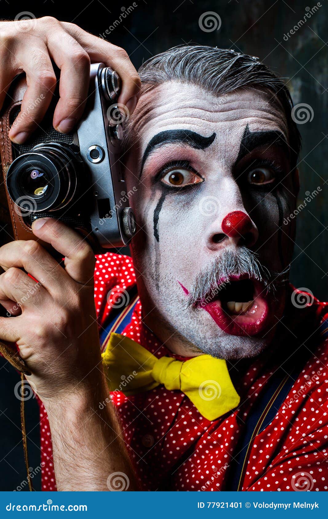 The Scary Clown and a Camera on Dack Background. Halloween Concept ...