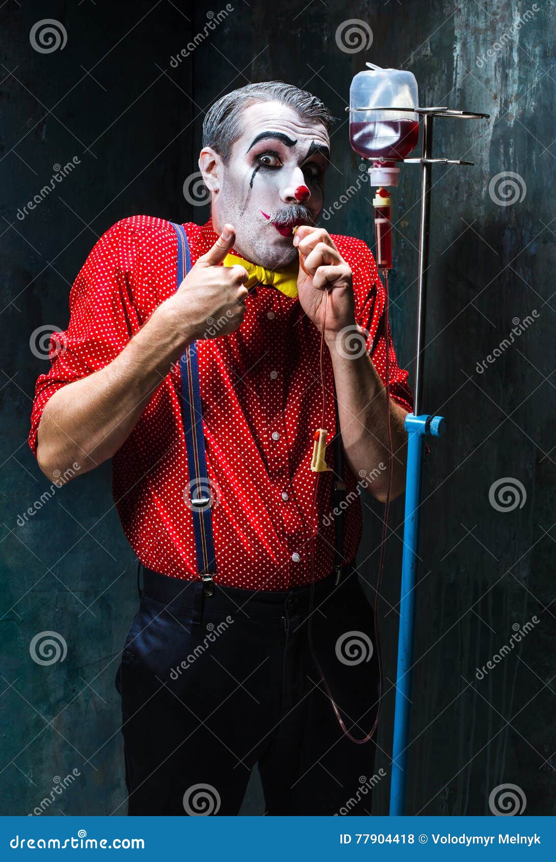 The Scary Clown and Drip with Blood on Dack Background. Halloween ...